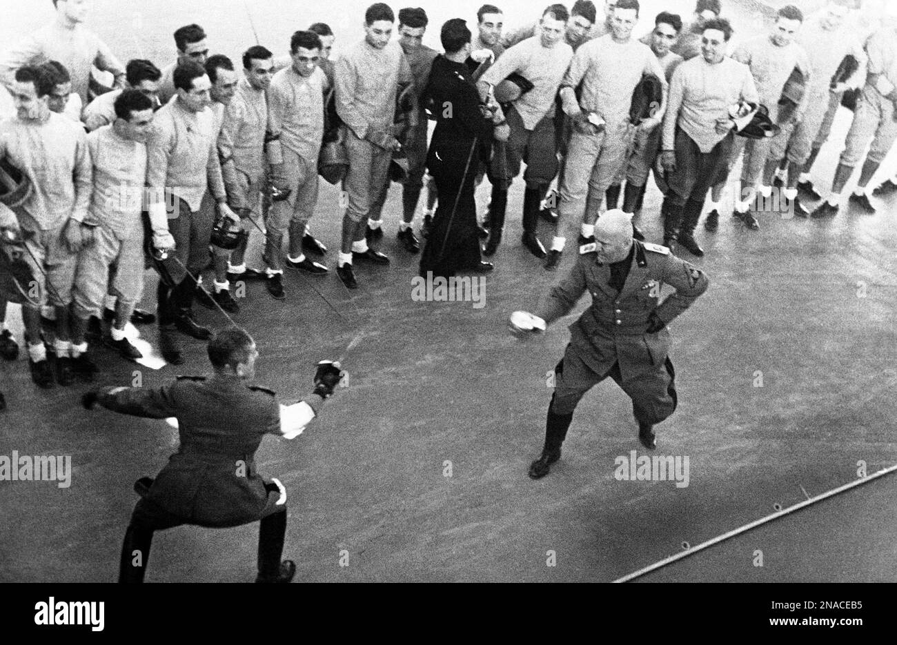 Benito Mussolini, right, fighting a fencing duel with a Fascist militia ...
