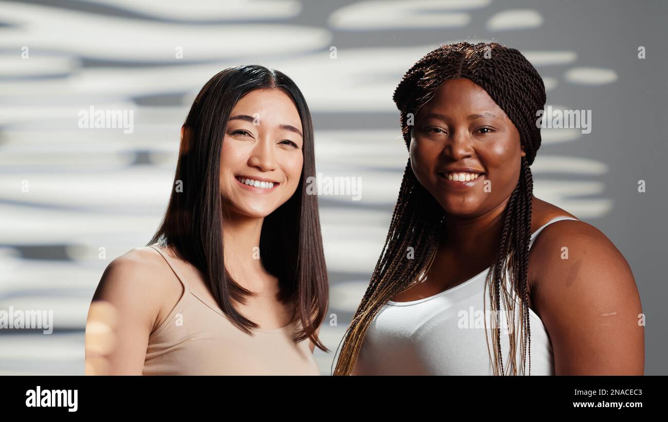 Diverse women hugging and expressing self love, doing skincare and ...