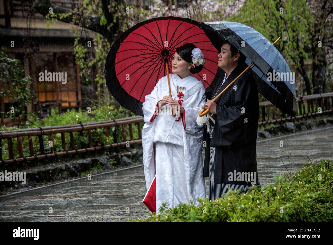 Couple in the historic area of Kyoto wearing traditional dress for an ...