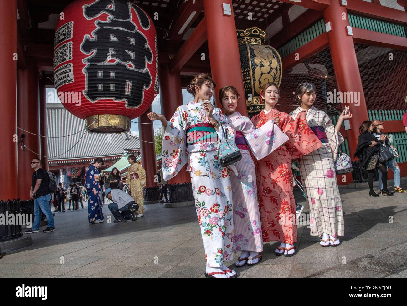 Women in traditional dress at Tokyo's Asakusa shrine, a major tourist ...