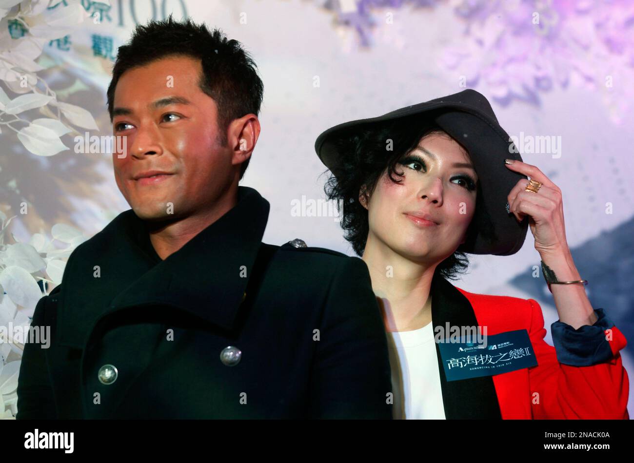Hong Kong actor Louis Koo, left, and actress Sammi Cheng pose at the ...