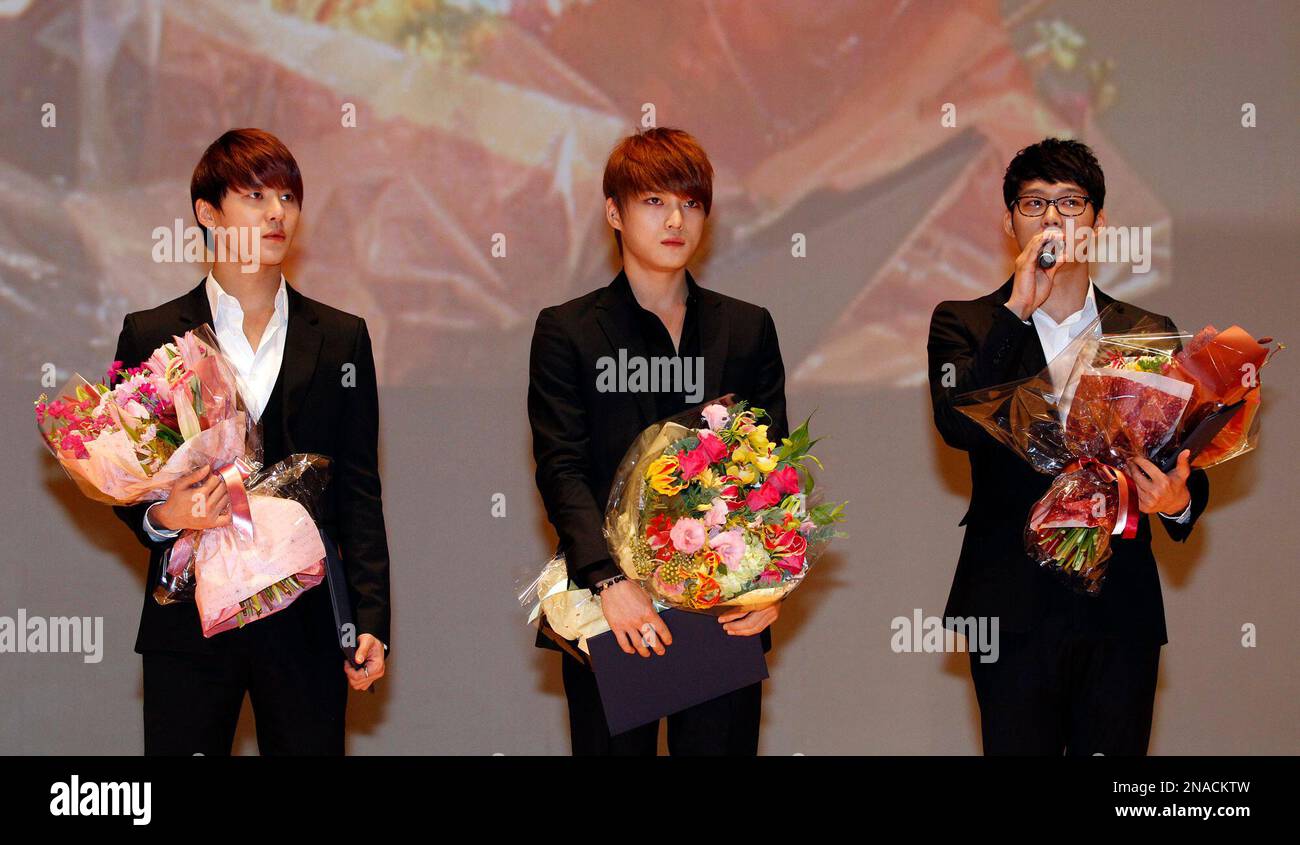 South Korean K-pop group JYJ's member Park Yu-chun, right, speaks ...