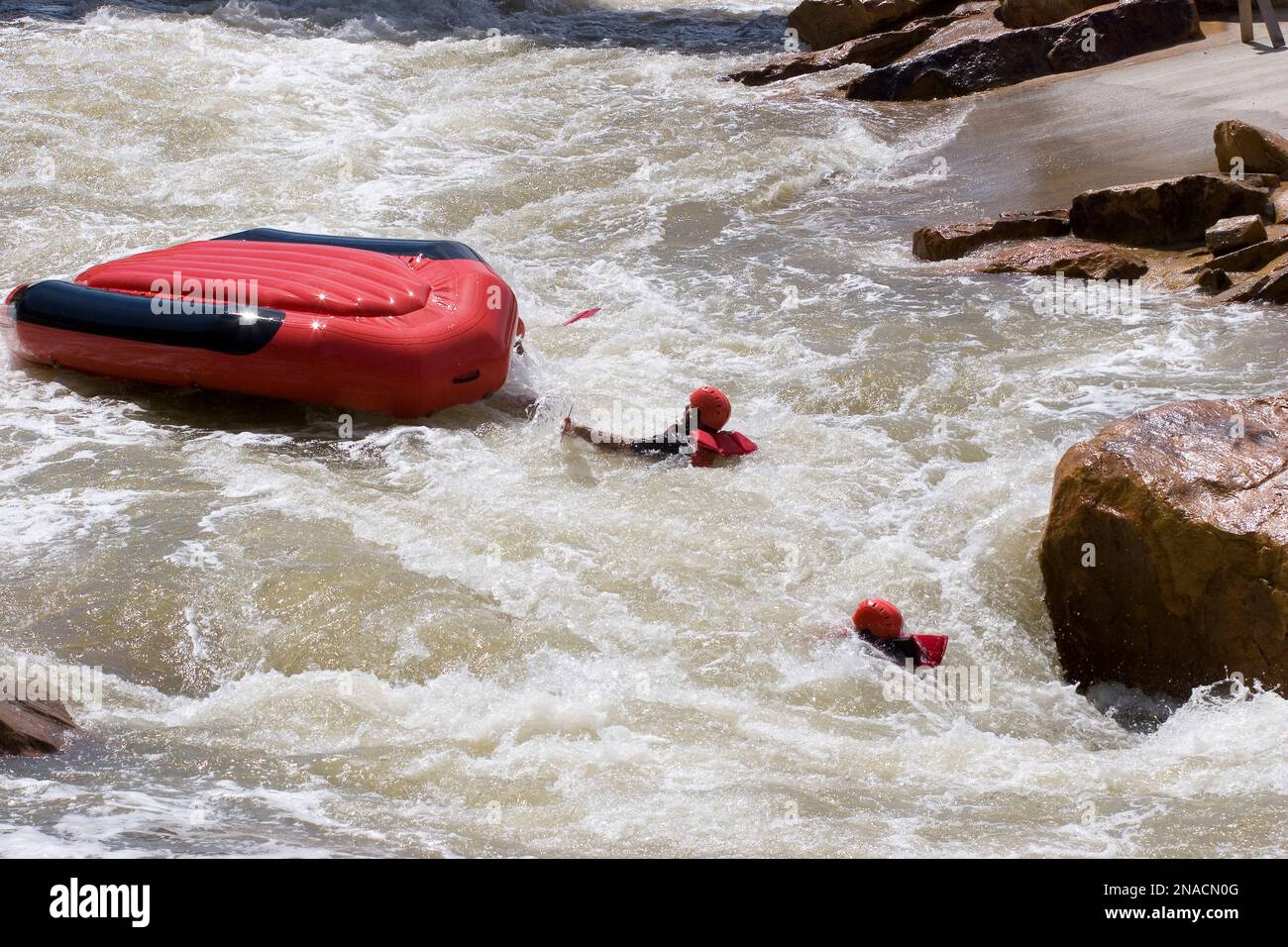 Two whitewater rafters swim after their raft flips, Wisp Resort, Deep ...
