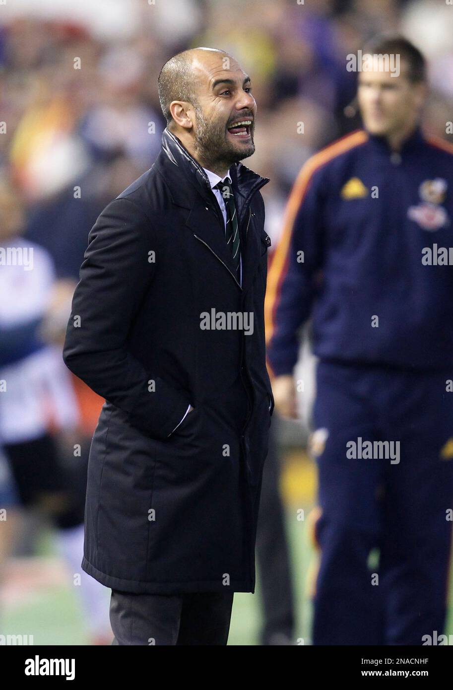 Barcelona's coach Pep Guardiola, gesture to their players during their ...