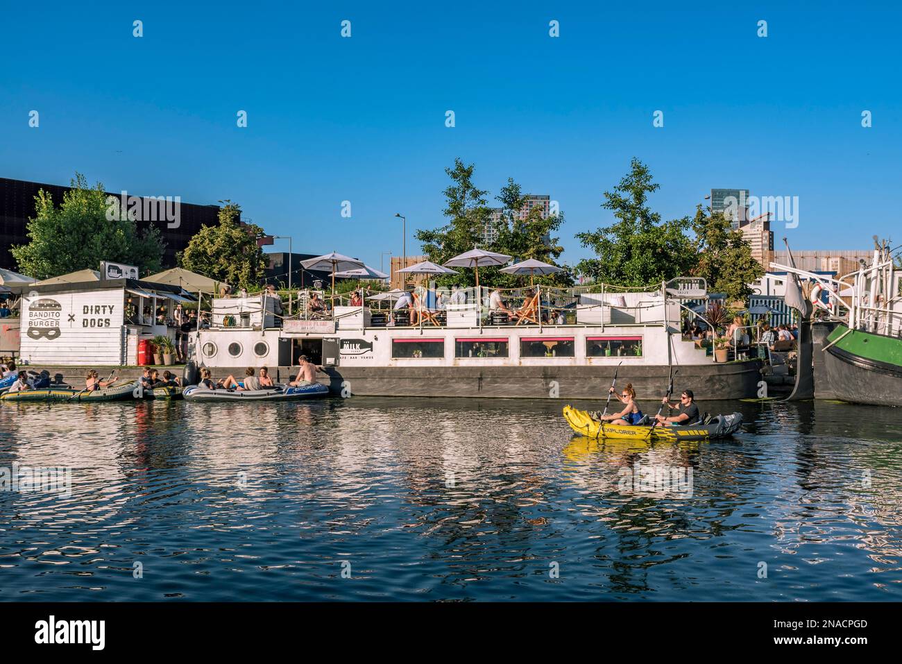 People having fun on a sunny day in Hackney Wick, London, England ...