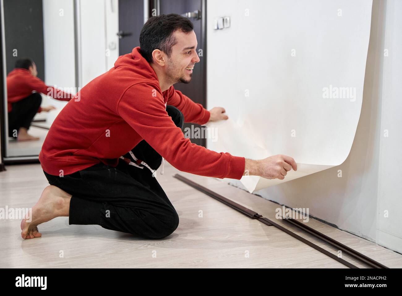 Repair the house with their own hands. The guy is ripping the old ...