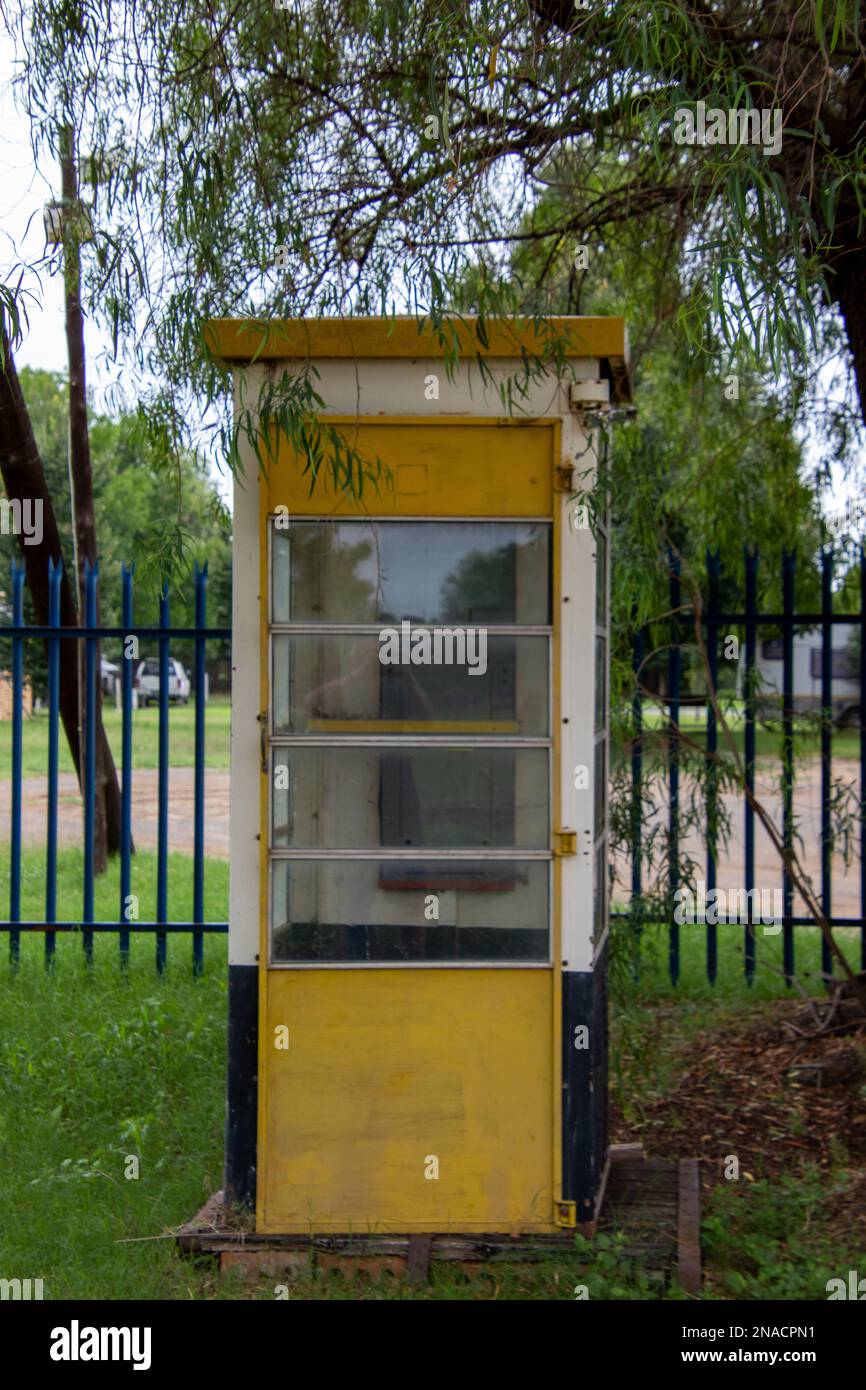 Abandoned phone booth isolated Stock Photo - Alamy