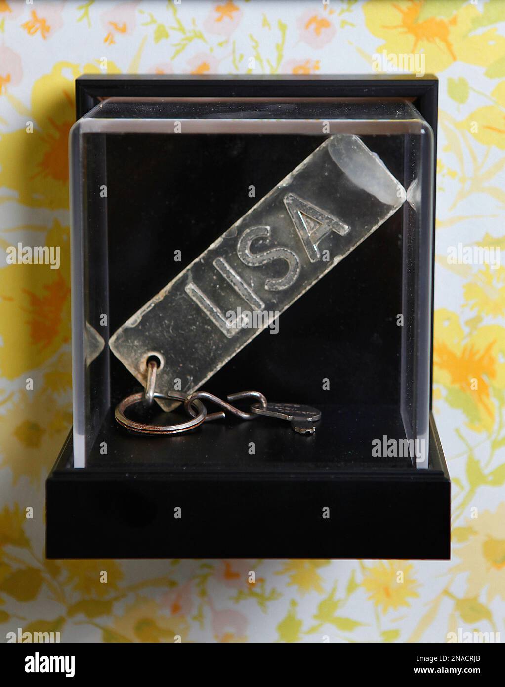 A golf cart key with the name of Lisa engraved is one of LIsa Marie ...