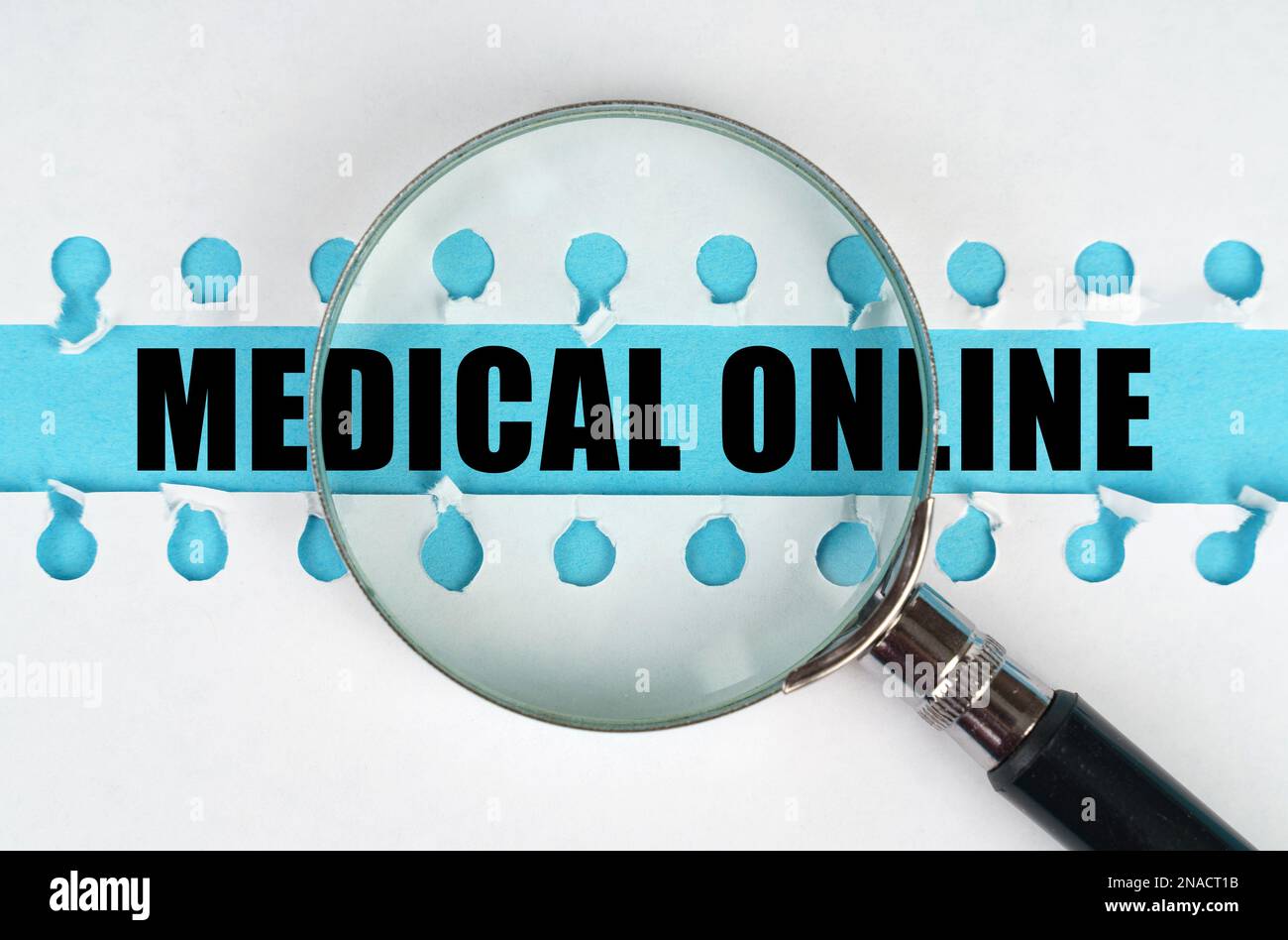 Between two sheets from a notebook on a blue stripe with the ...