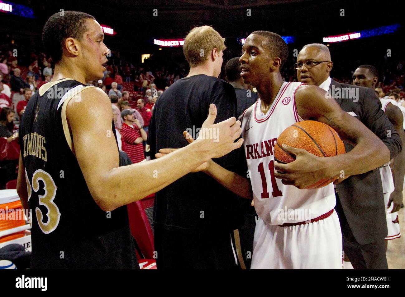 Arkansas' BJ Young (11) shakes hands with Vanderbilt's John Jenkins (23 ...