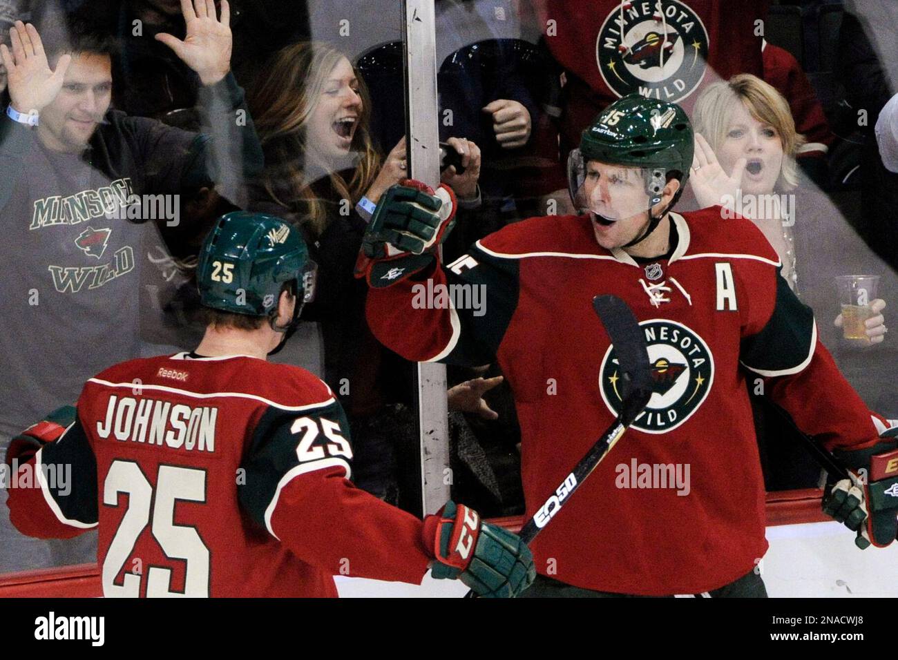 Minnesota Wild's Nick Johnson (25) skates in to celebrate the first of ...
