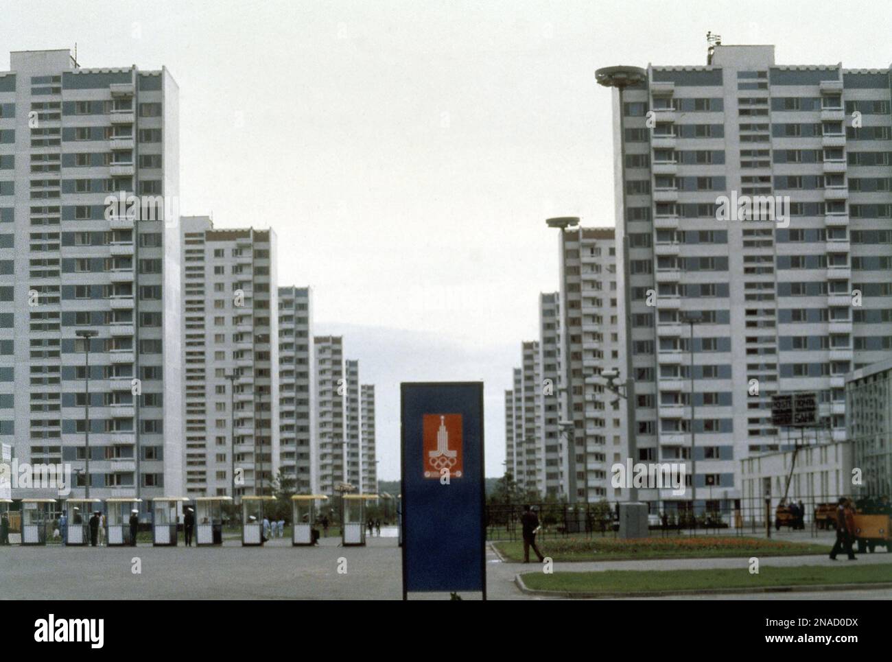 Gateways lined up at an entrance to the Olympic Village which has tower ...