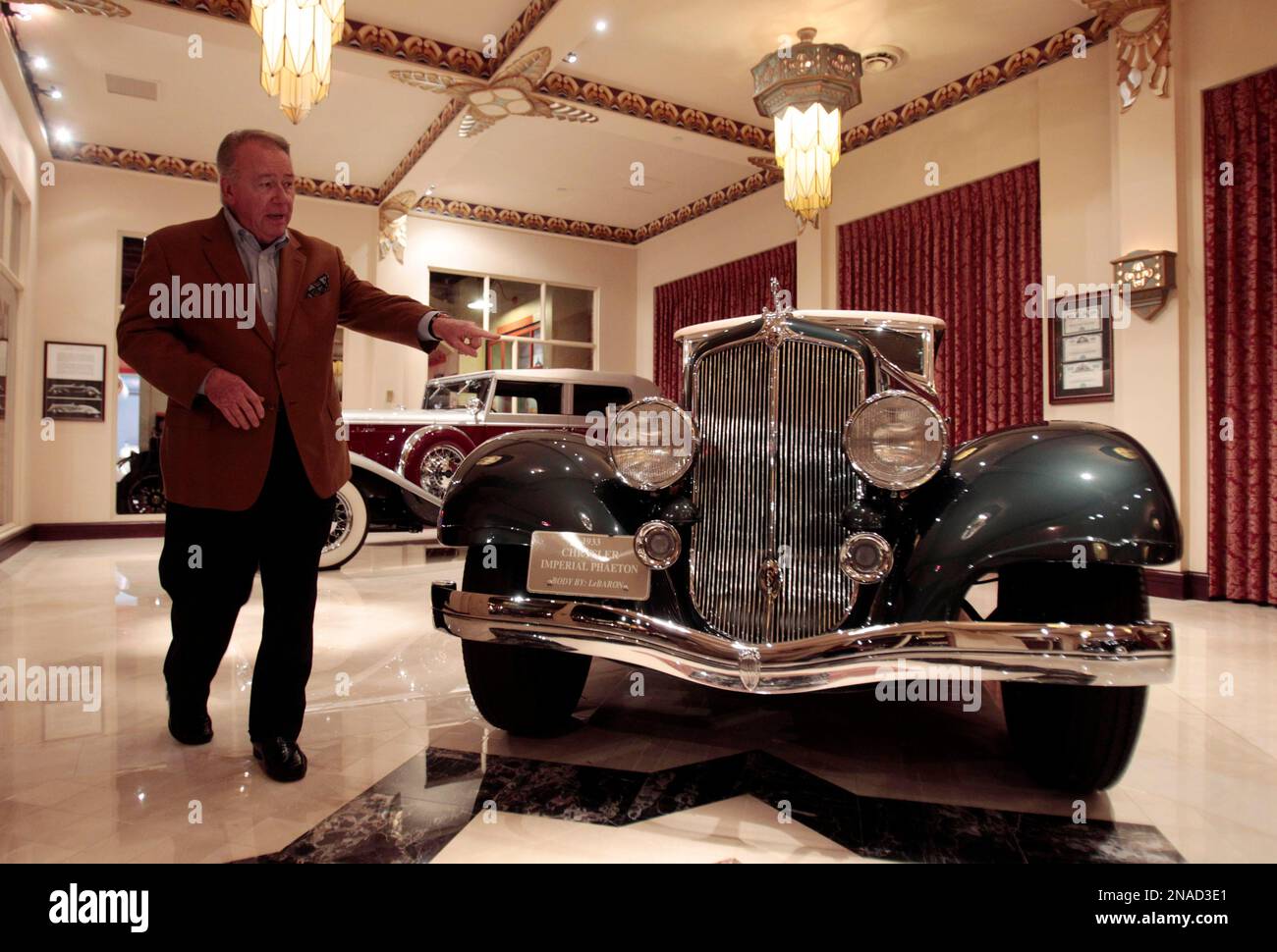 In this Jan. 26, 2012 photo, Bob Milhous shows a 1933 Chrysler Phaeton ...