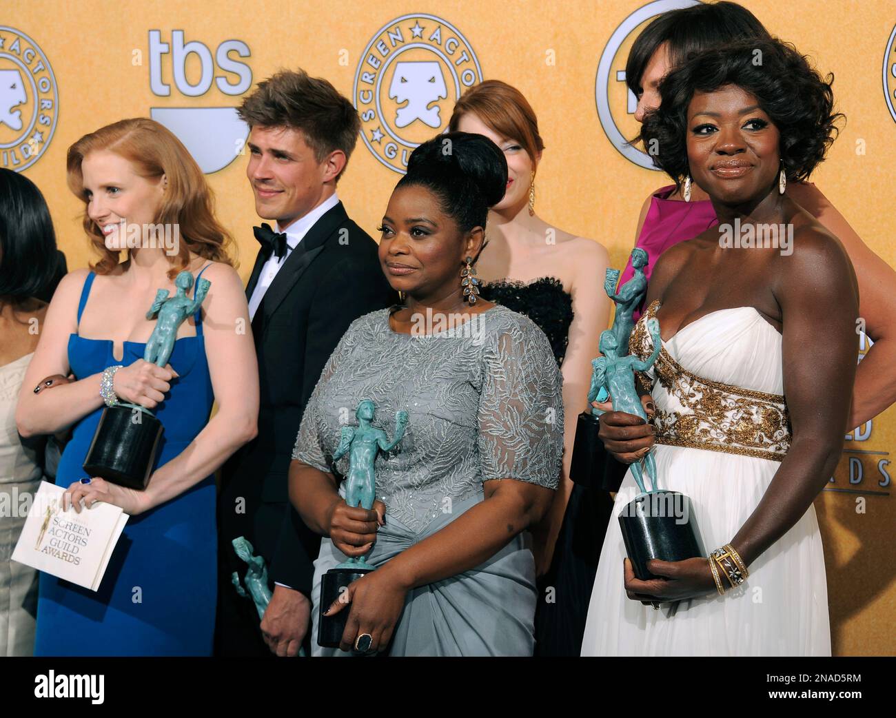 Cast members of "The Help" pose backstage with their awards for ...