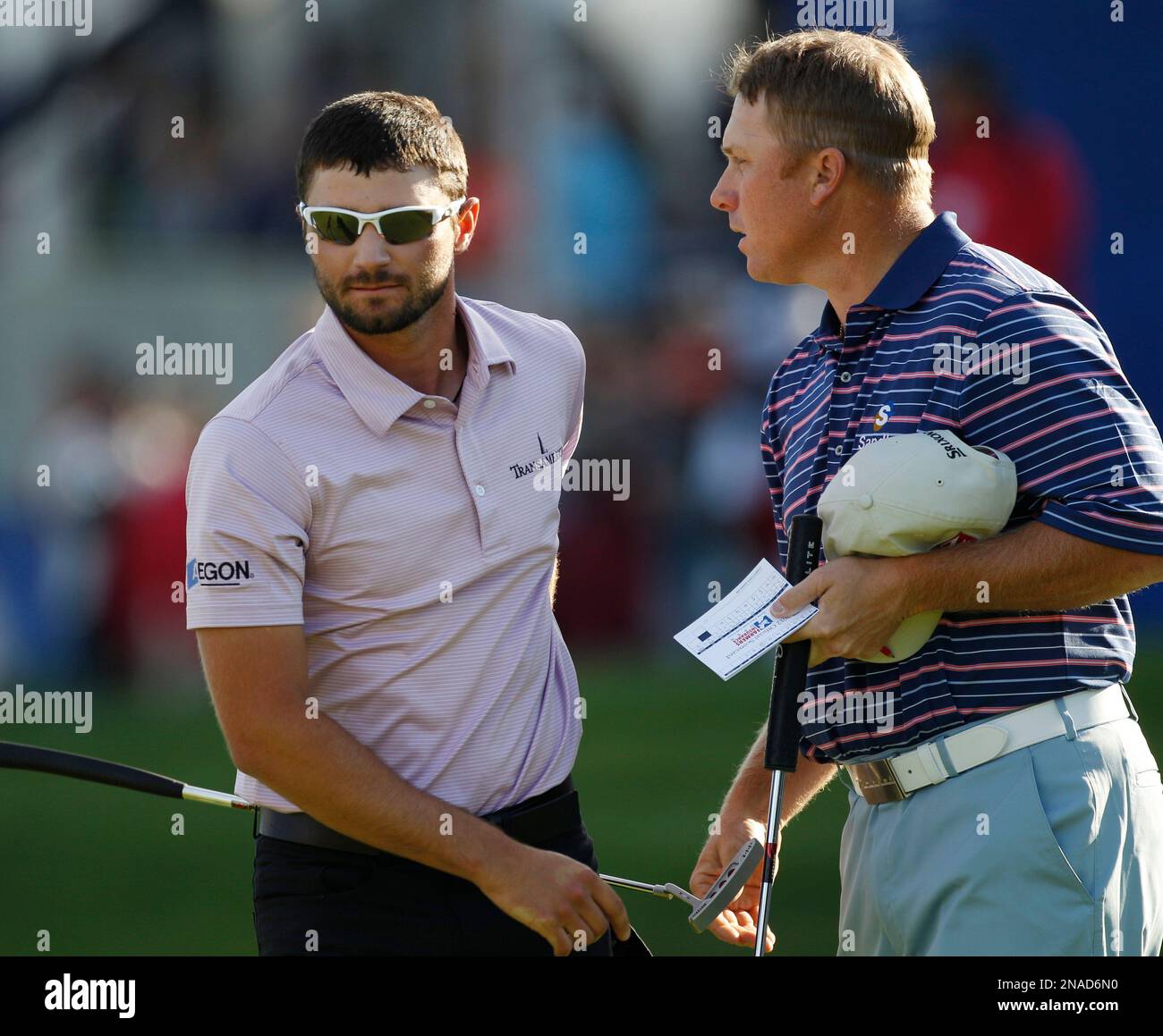 Kyle Stanley is consoled by John Rollins, right, after making a triple ...