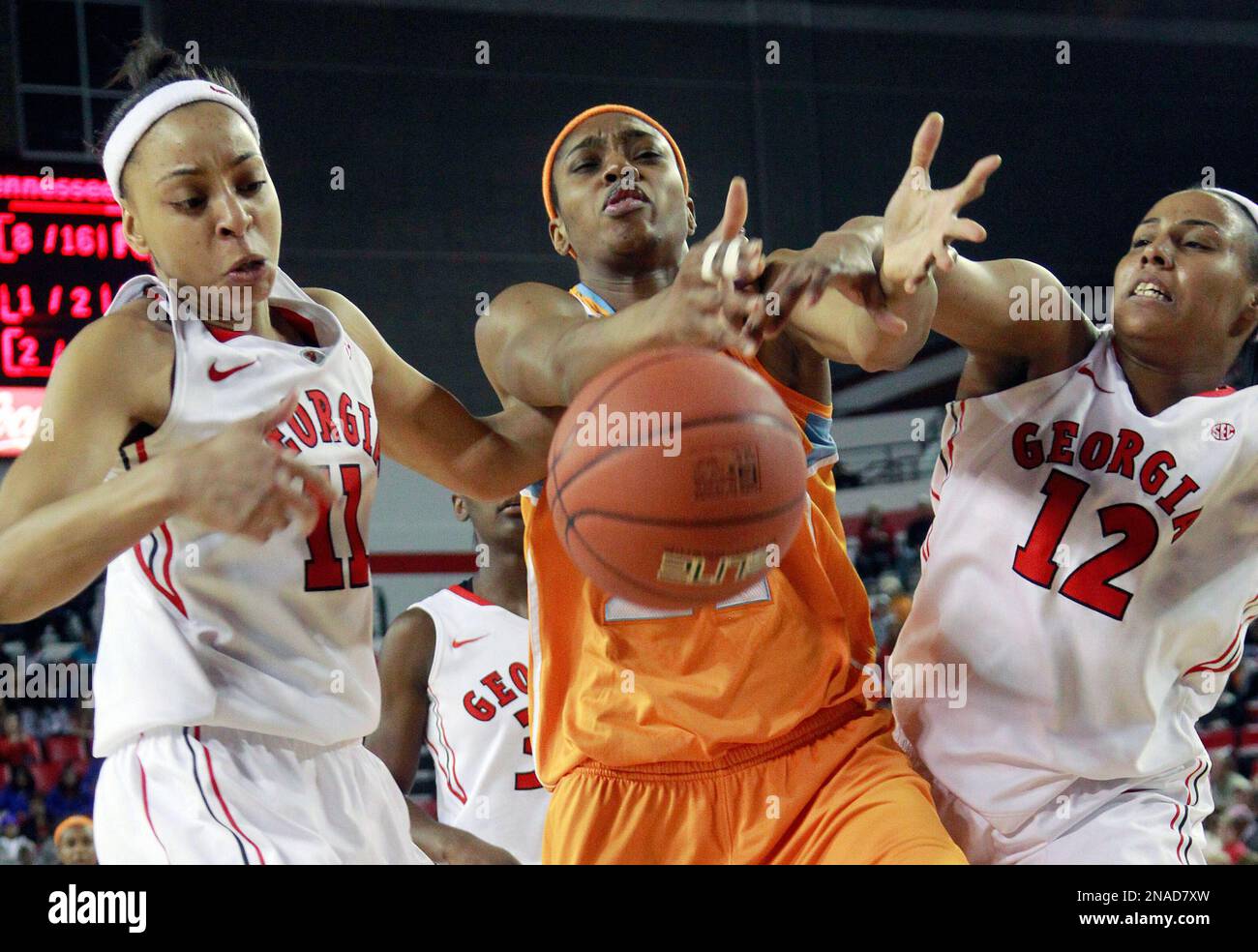 Tennessee forward/center Isabelle Harrison, center, battles Georgia's ...