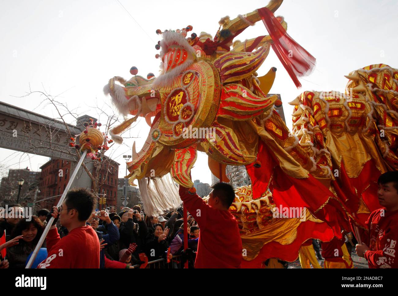 Dragon dancers parade through the streets of Chinatown during the ...