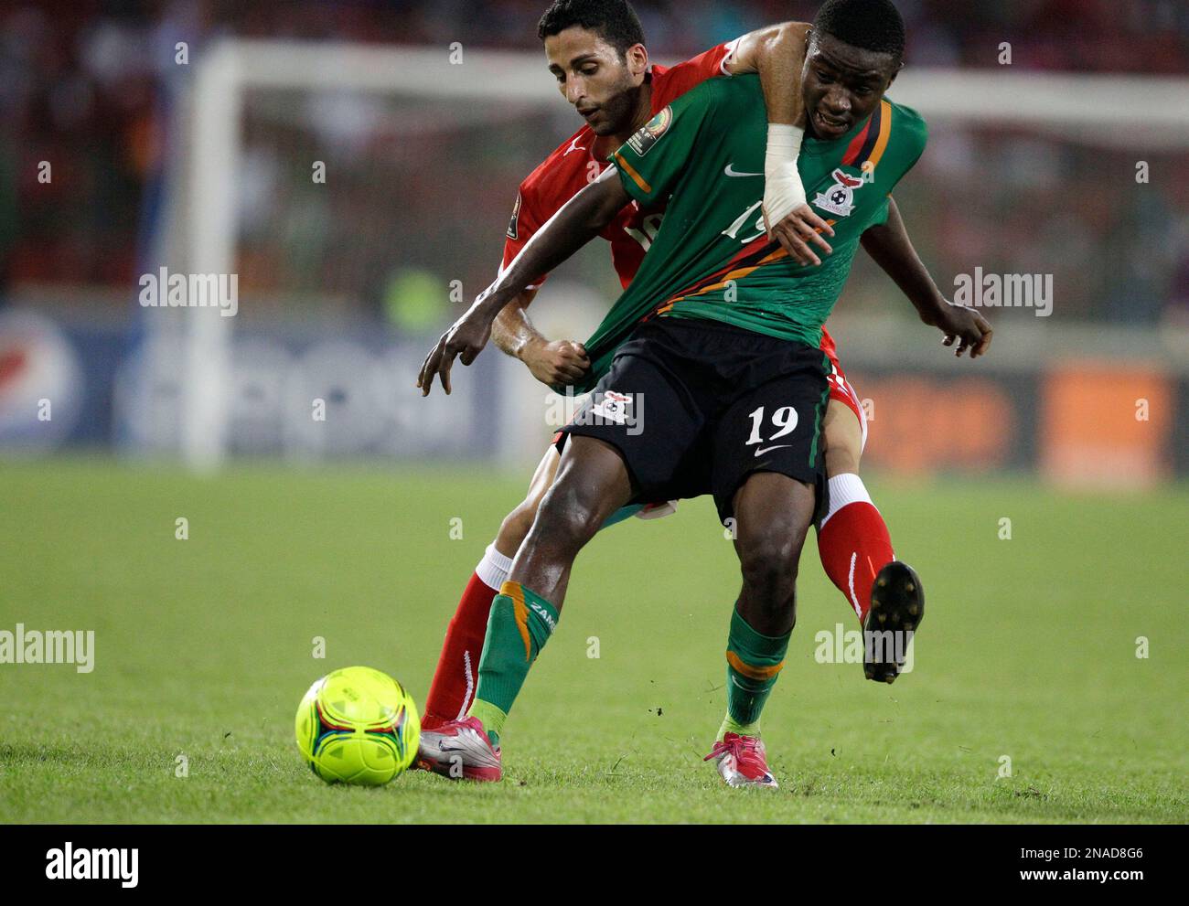 Zambia's Nathan Sinkala, front, tussles with Equatorial Guinea's Ivan ...