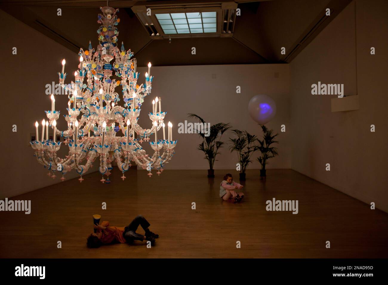 Children play around the installation pieces "Morse Code", the ...