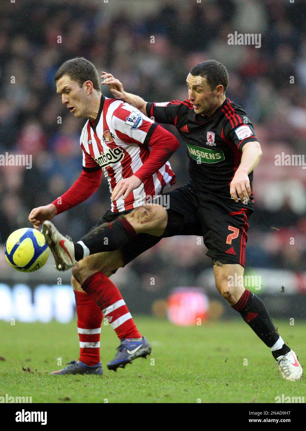 Sunderland's Craig Gardner, left, vies for the ball with Middlesbrough ...