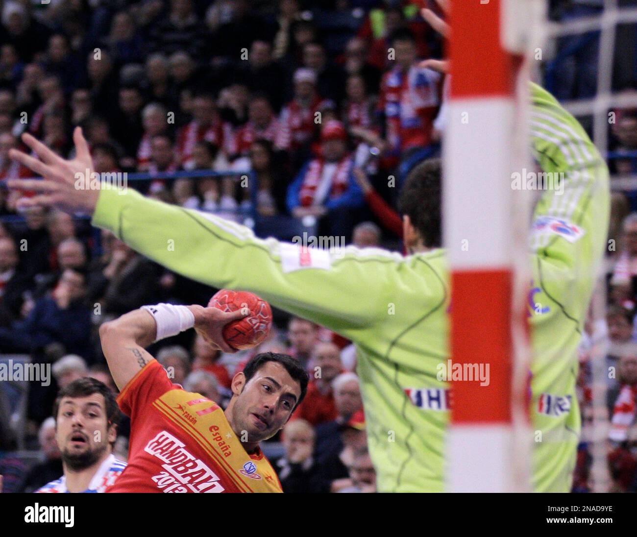 Croatia's goalkeeper Mirko Alilovic, right, tries to block a shot by ...