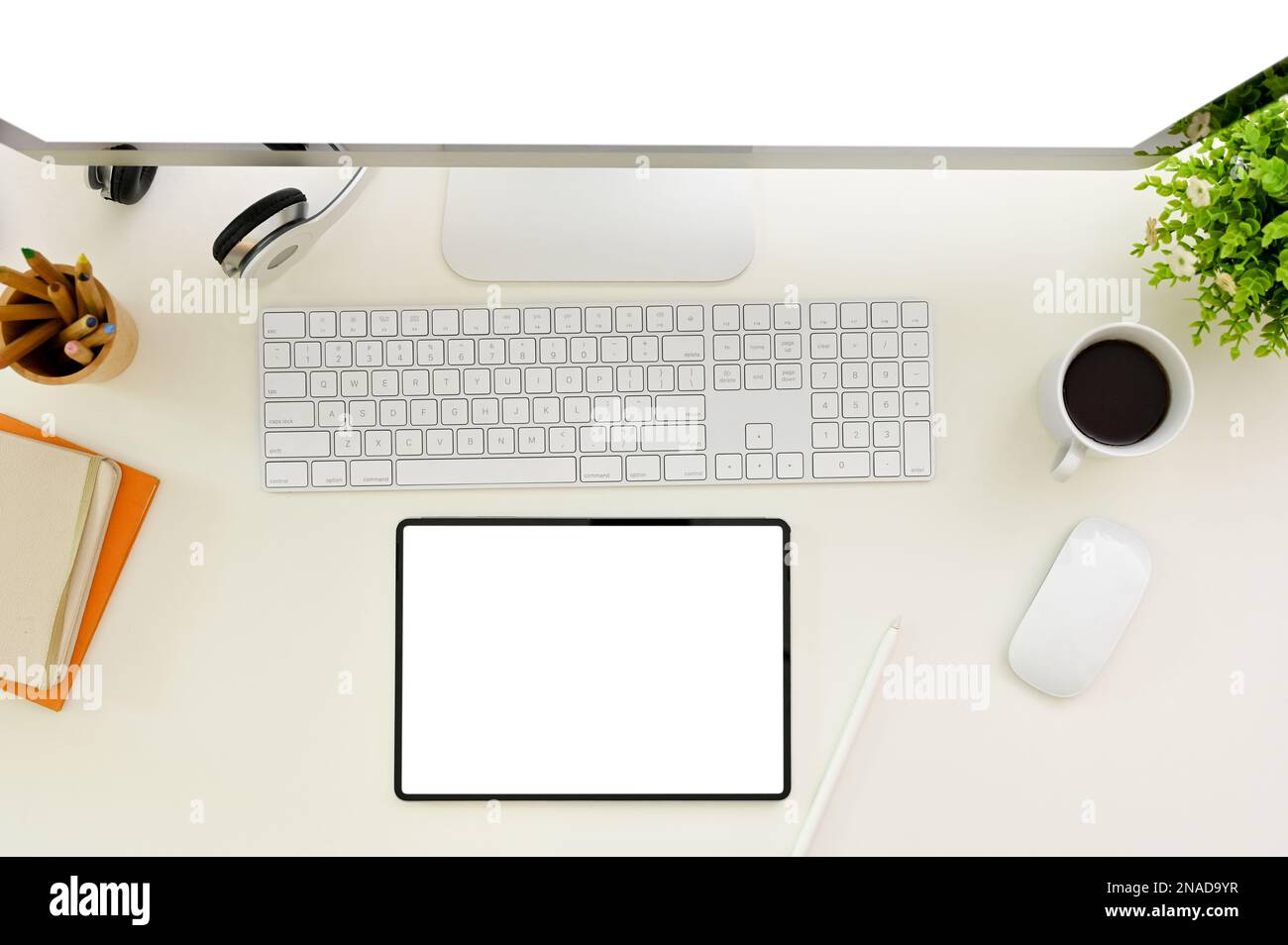 Top view of a modern white office desk with digital tablet white screen ...