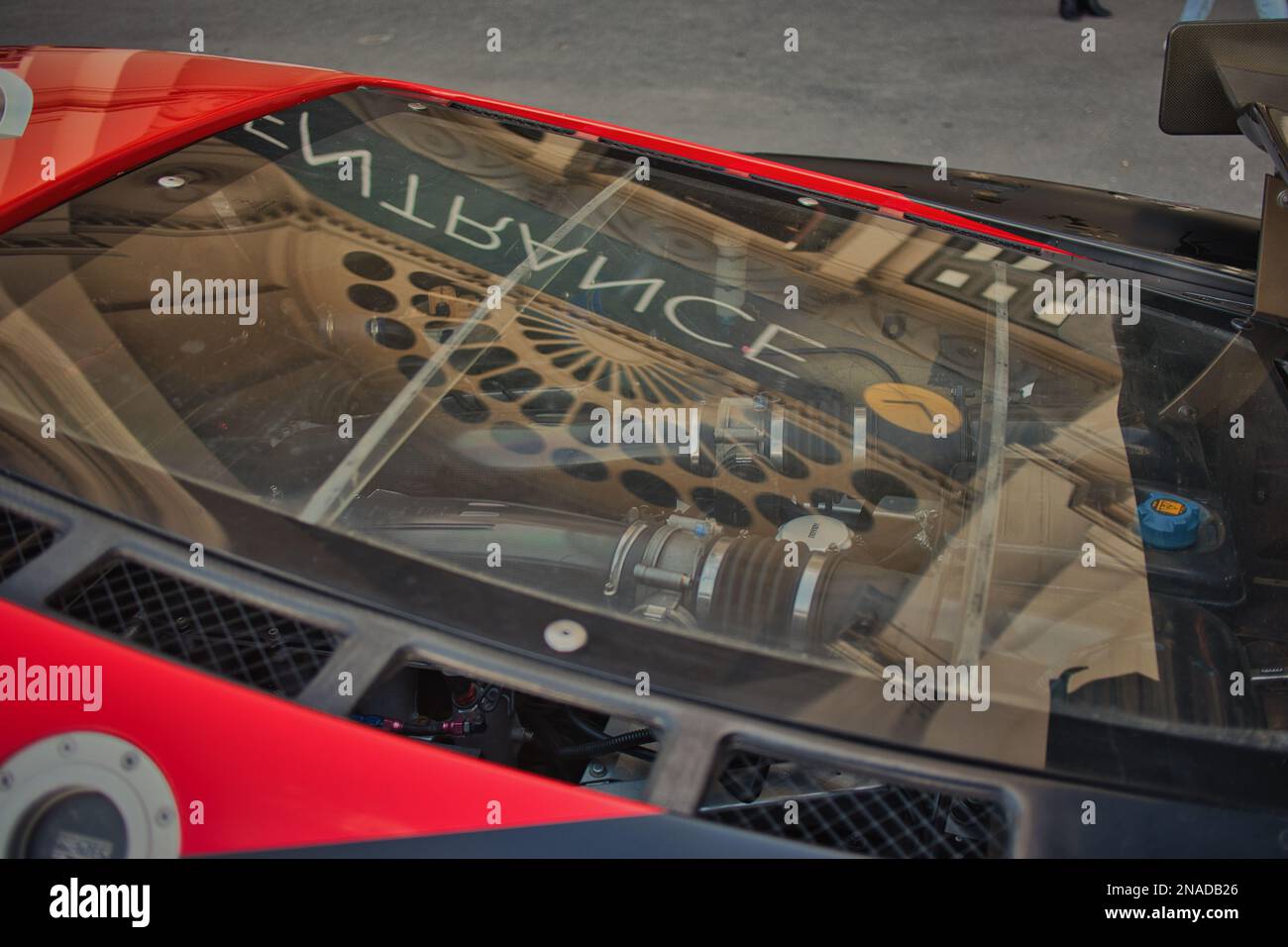 A close-up of a red Ferrari rear glass window Stock Photo - Alamy