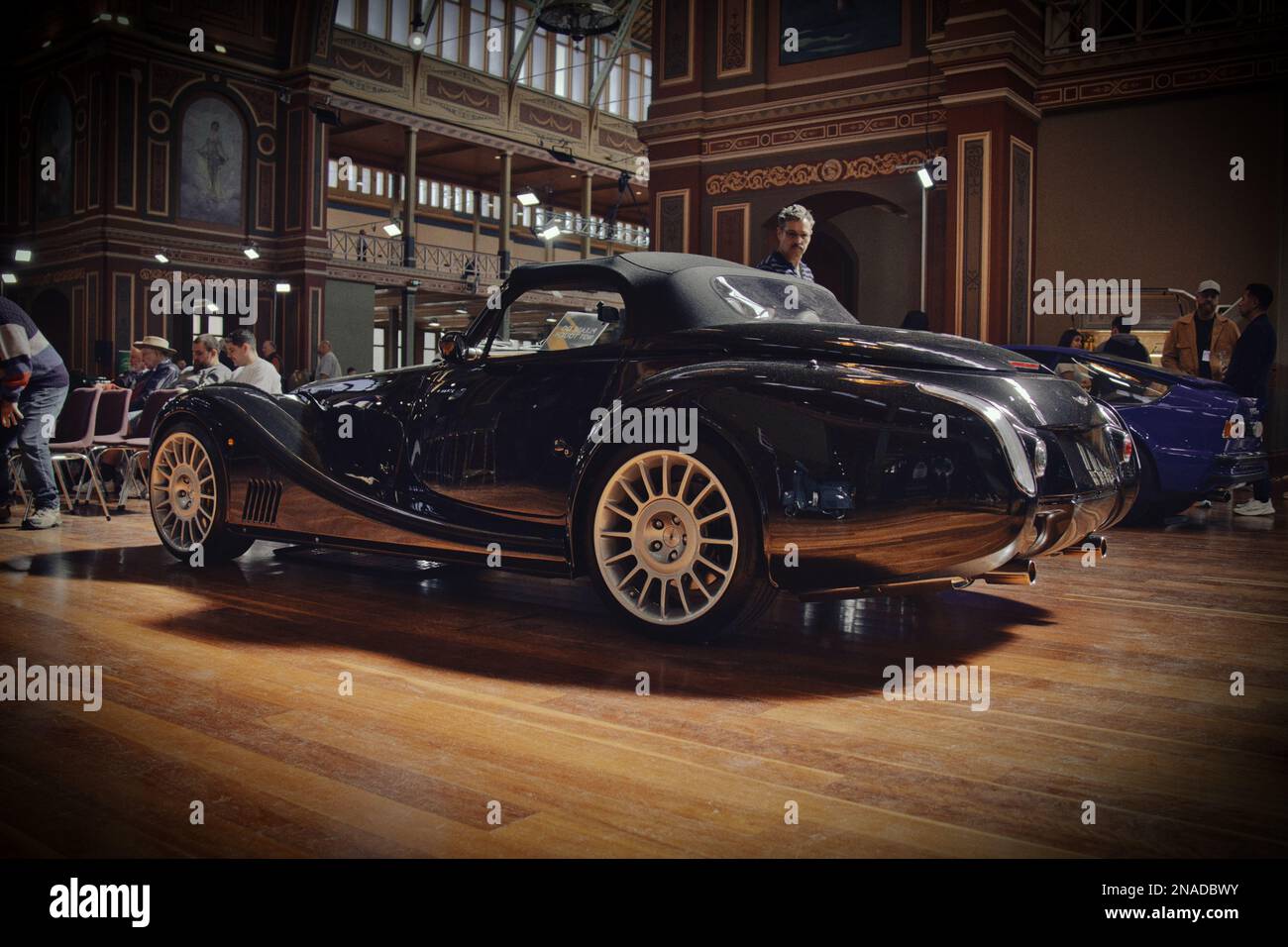 A black Morgan Plus 4 coupe car at a salon Stock Photo - Alamy