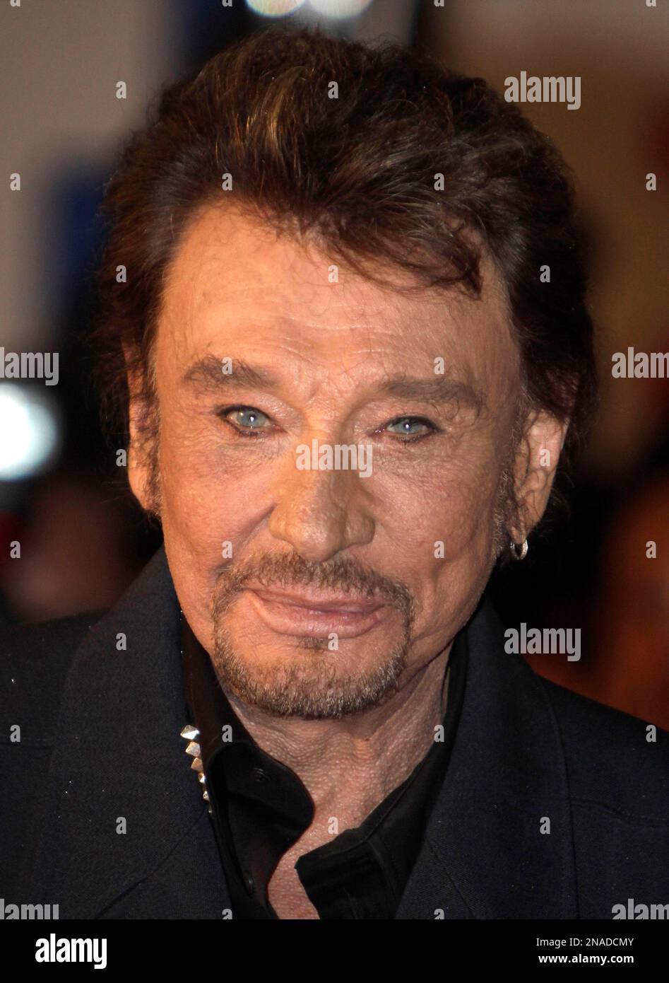 French singer Johnny Hallyday arrives at the Cannes festival palace to ...