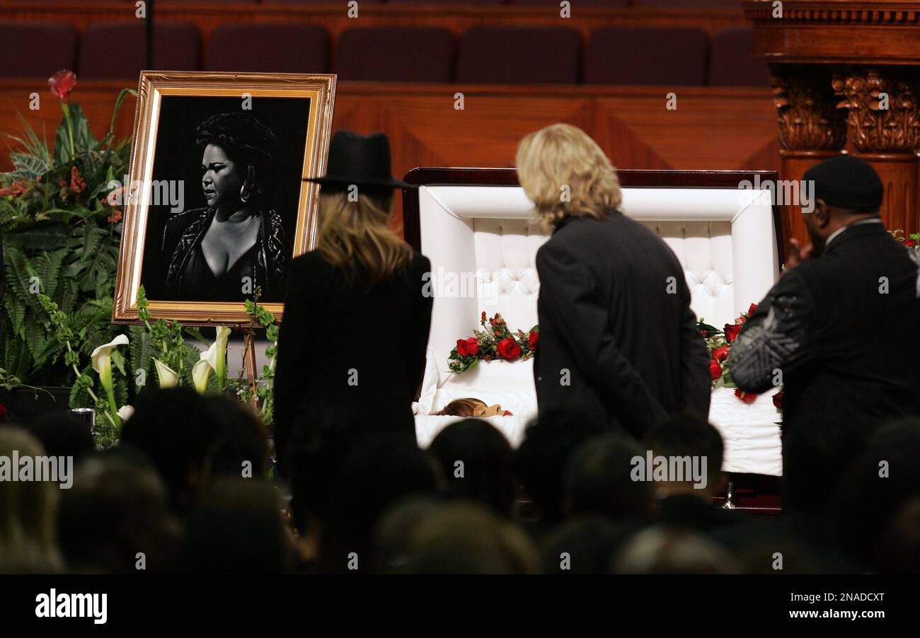 Friends, fans and family line for a final view in the funeral of singer ...