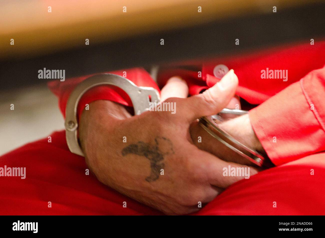 This Wednesday, Oct. 26, 2011 photo shows the handcuffed hands of ...