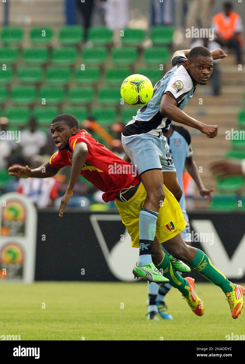 Botswana's Mogogi Gabonamong, right, wins the ball against Guinea's ...