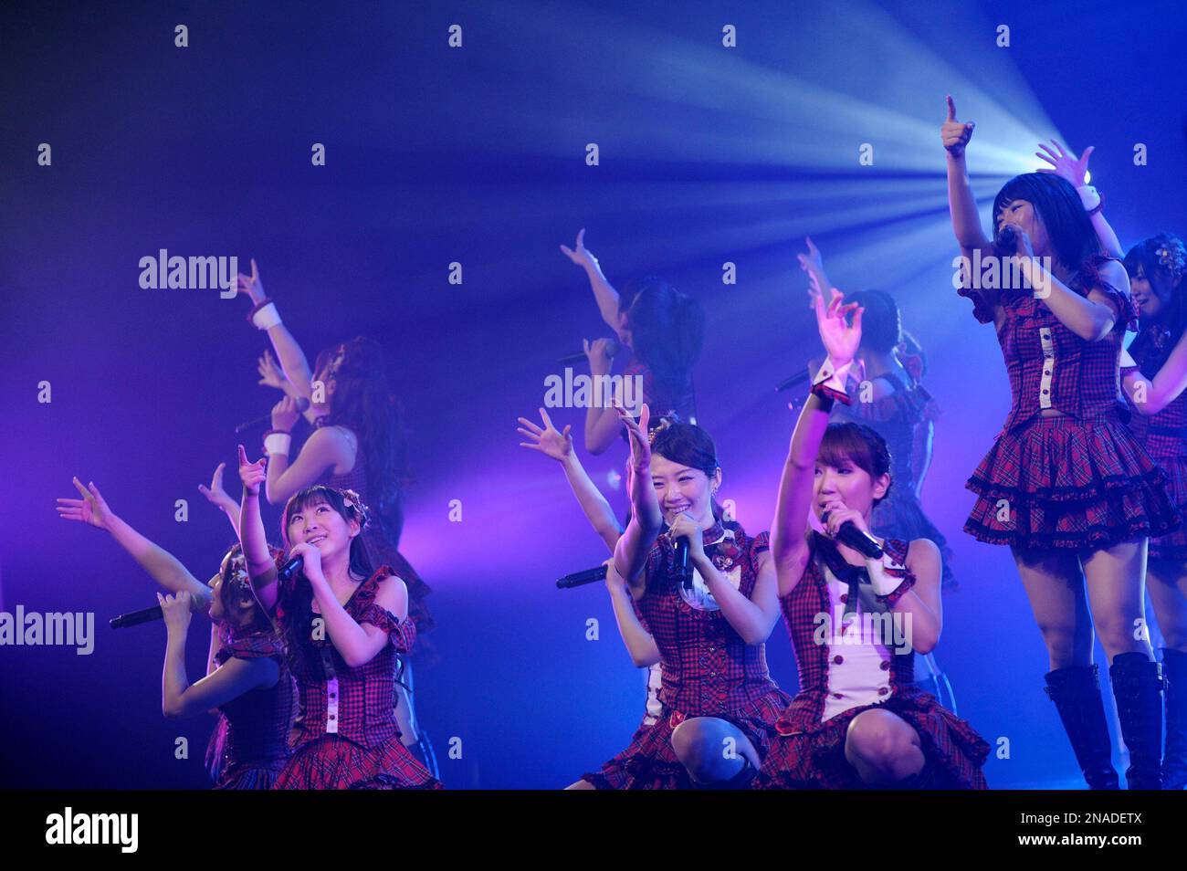 Members of Japanese girl group AKB48 perform during their concert in ...