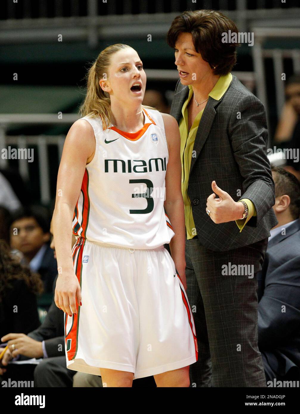 Miami's head coach Katie Meier, right, talks with Stefanie Yderstrom (3 ...