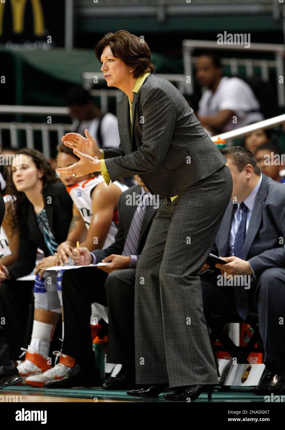 Miami's head coach Katie Meier claps during the first half of an NCAA ...