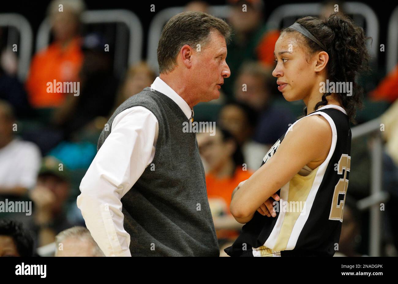 Wake Forest's head coach Mike Petersen, left, talks with Dearica Hamby ...