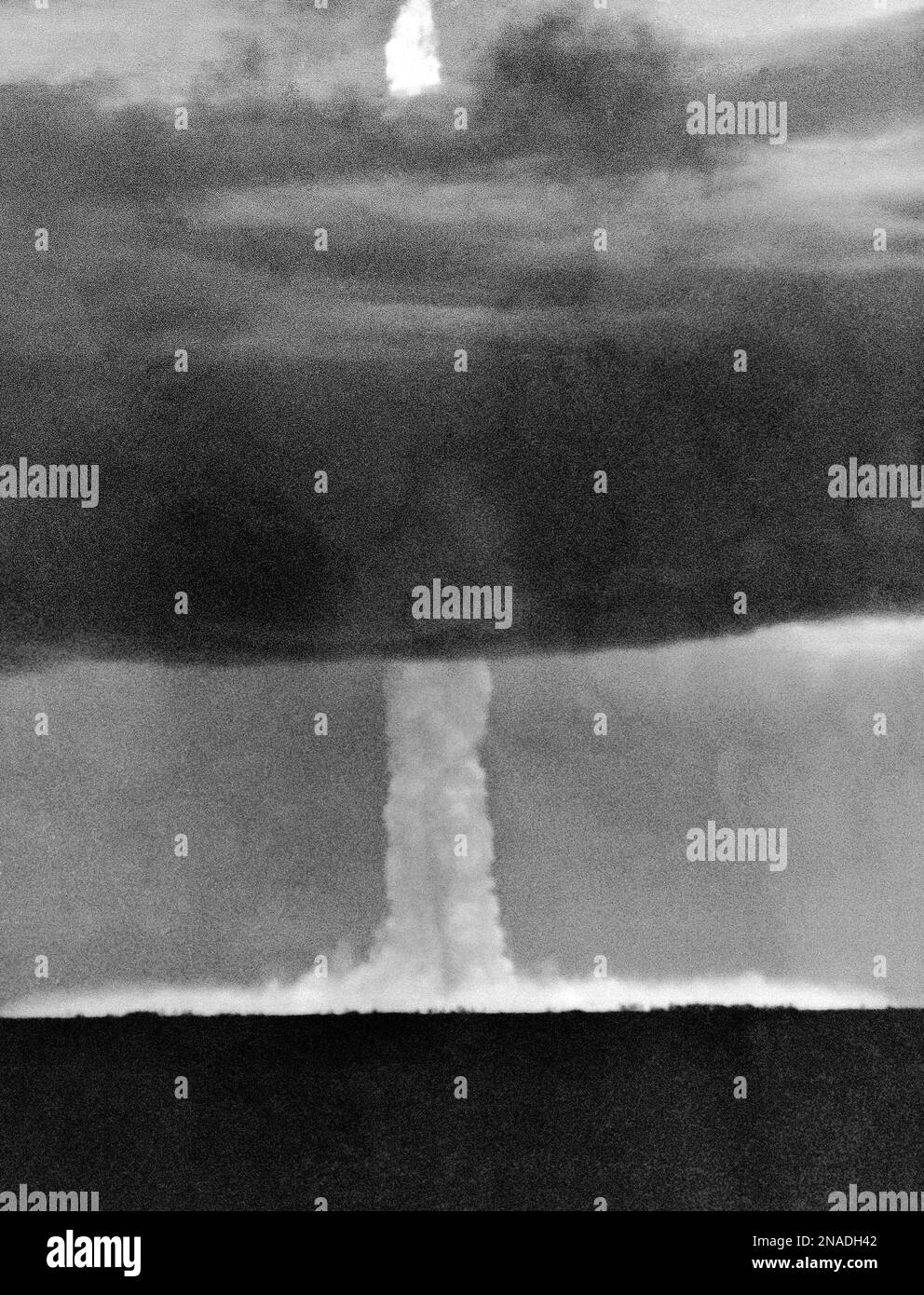 The long white stem of an H-bomb exploded in the Bikini Atoll on May 21 ...
