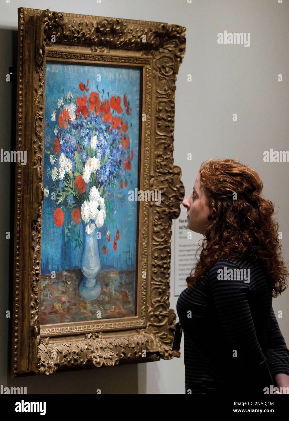 Kristin Patterson looks at Vincent Van Gogh's painting "Vase with ...