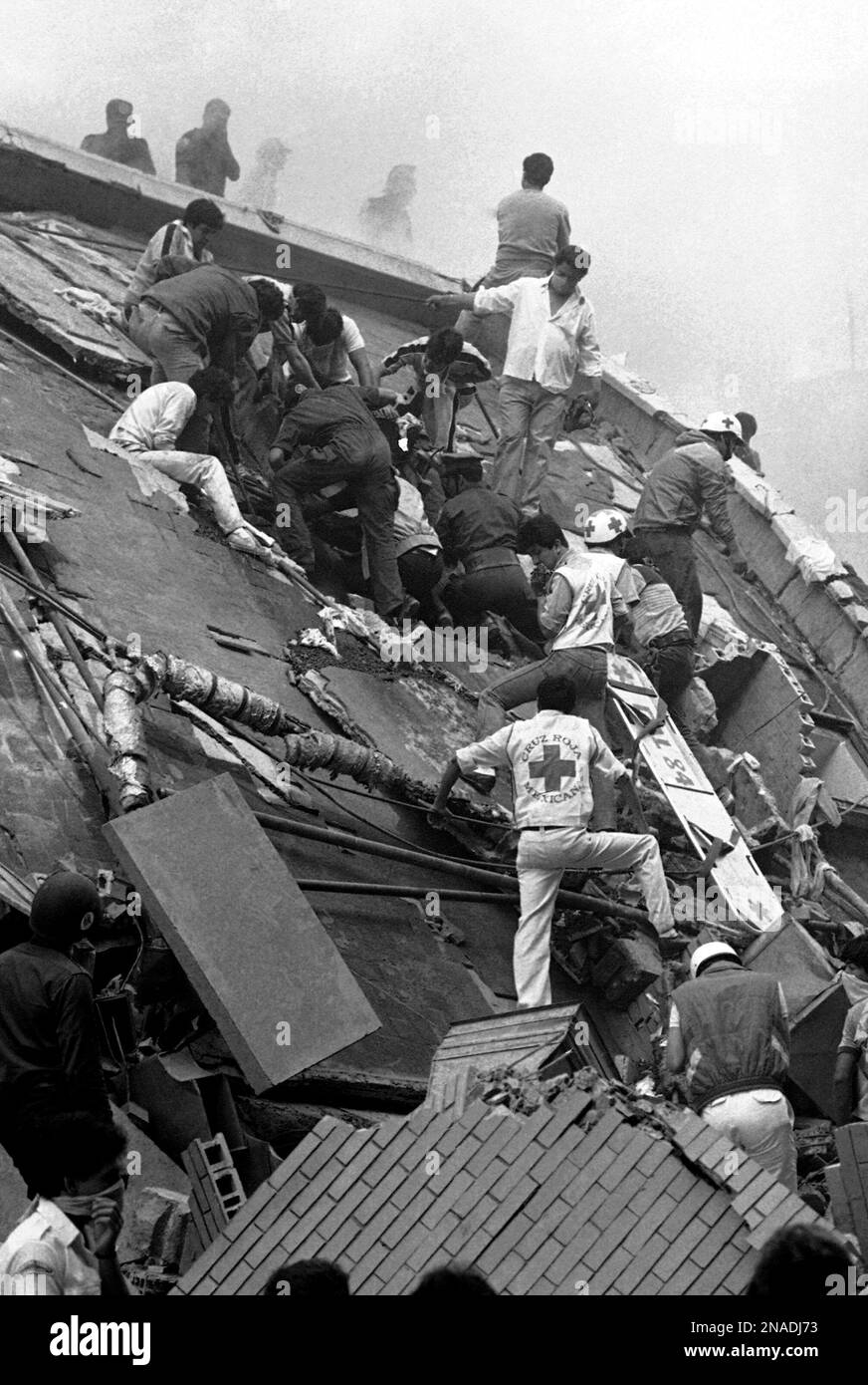 Rescue workers search through the rubble in Mexico City caused by an ...