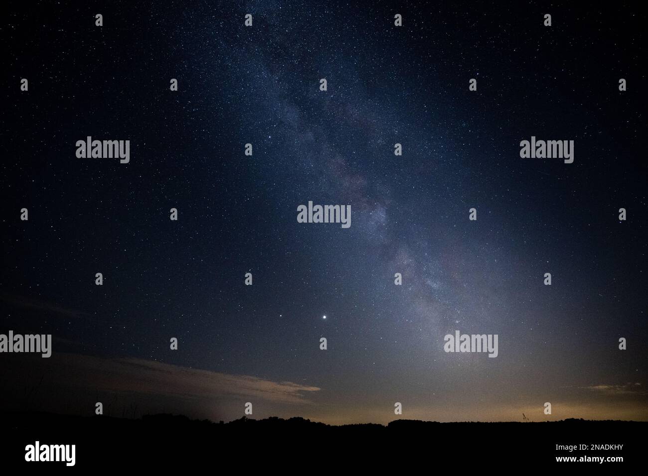 A breathtaking view of a starlit night sky, with the Milky Way ...