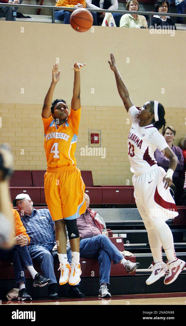 Tennessee guard Kamiko Williams (4) shoots past Alabama guard Jessica ...