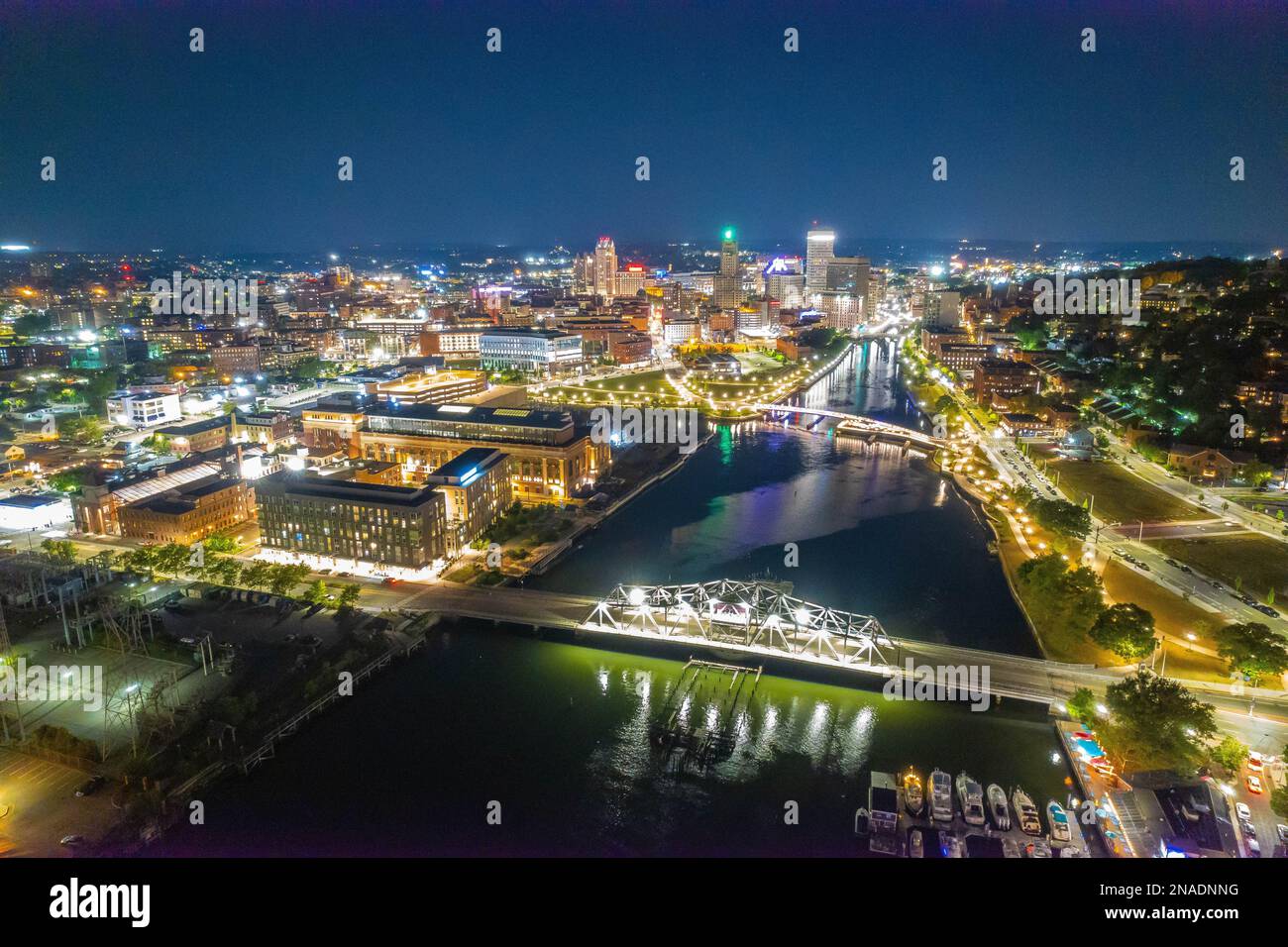 An aerial view of cityscape Providence surrounded by buildings in night ...
