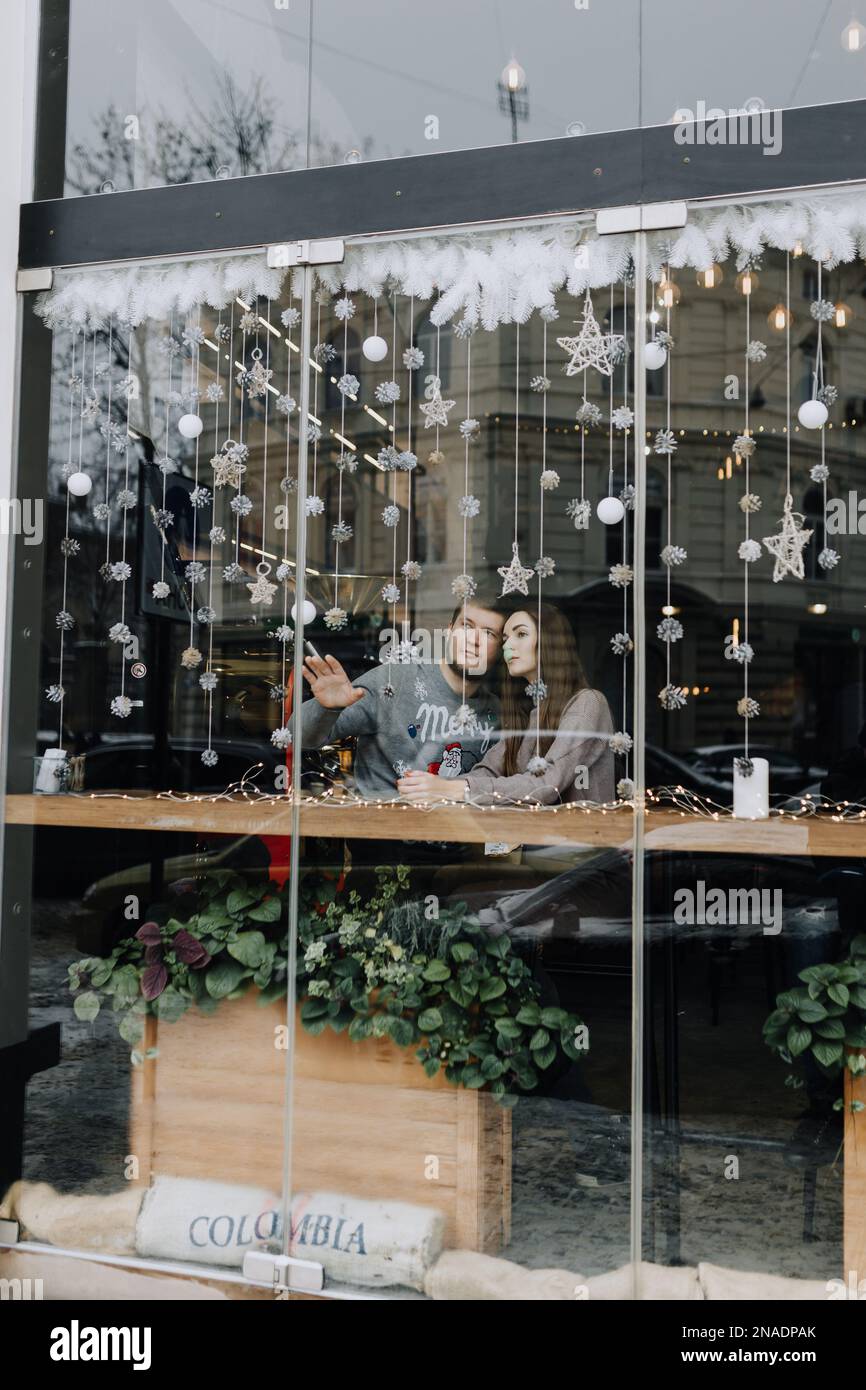 couple of lovers on a date in a winter cafe on holidays Stock Photo - Alamy