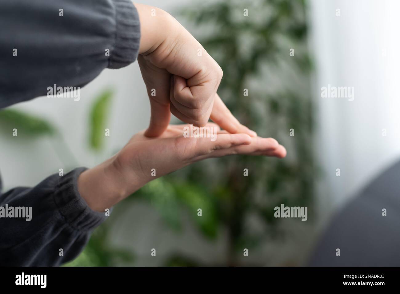 A smiley teenage girl hand sign Stock Photo - Alamy