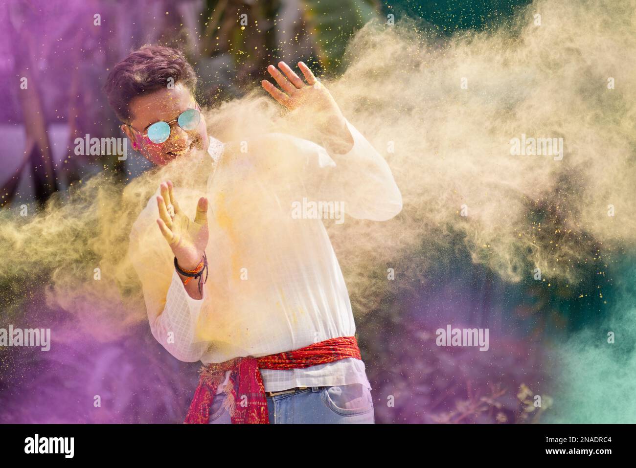 Young indian man celebrating holi color festival Stock Photo - Alamy