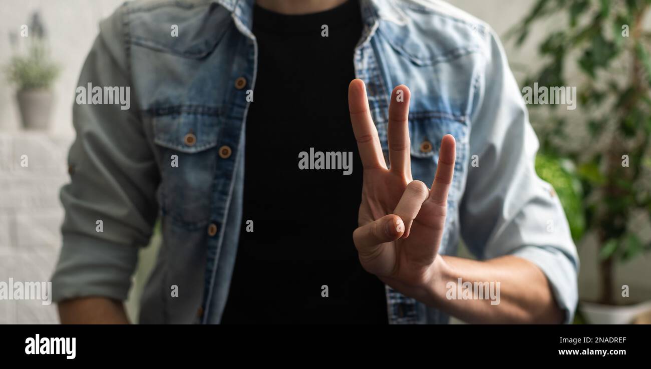 Sign language interpreter man translating a meeting to ASL, American ...