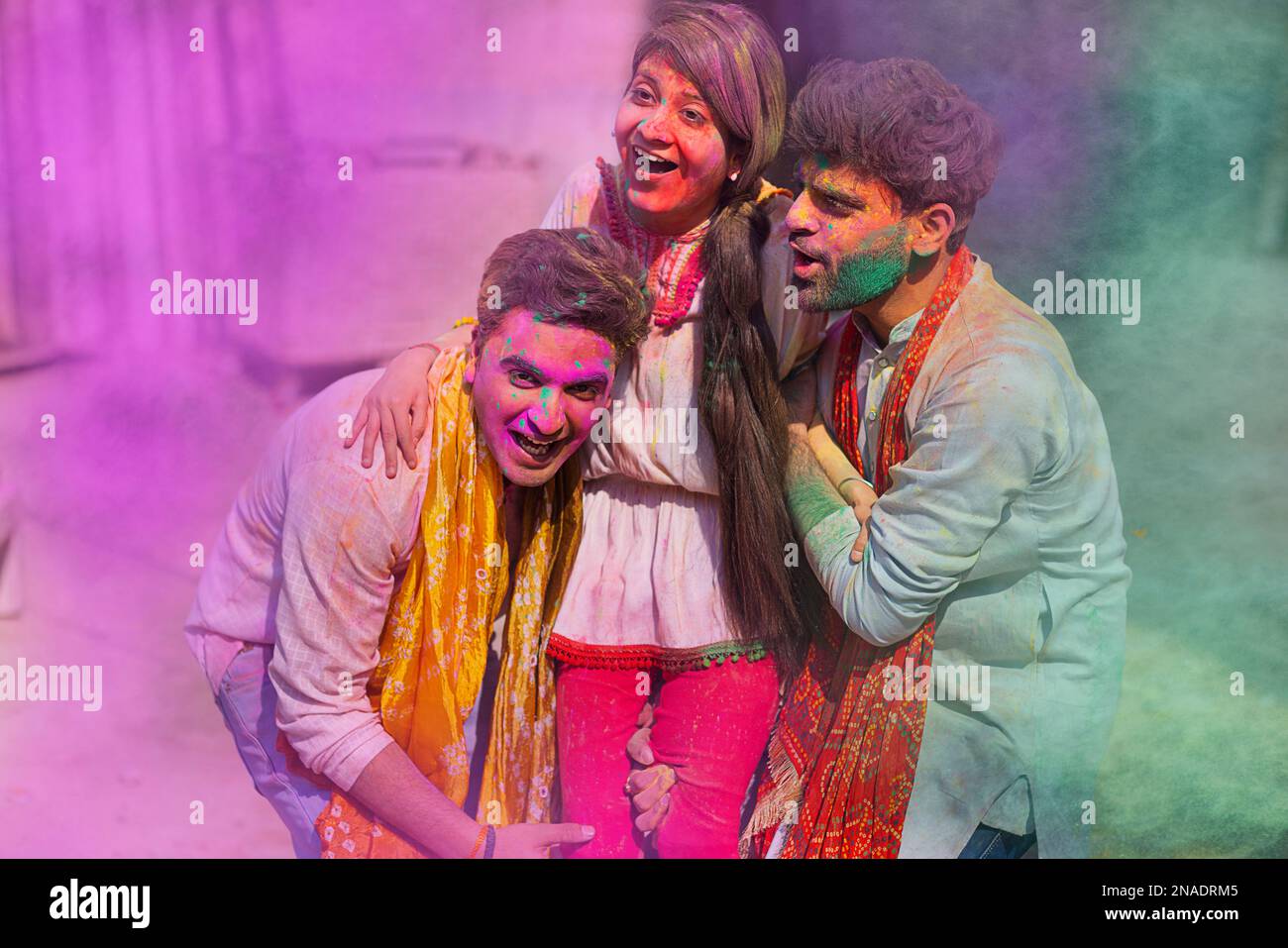 A group of friends celebrating holi in outdoor Stock Photo - Alamy