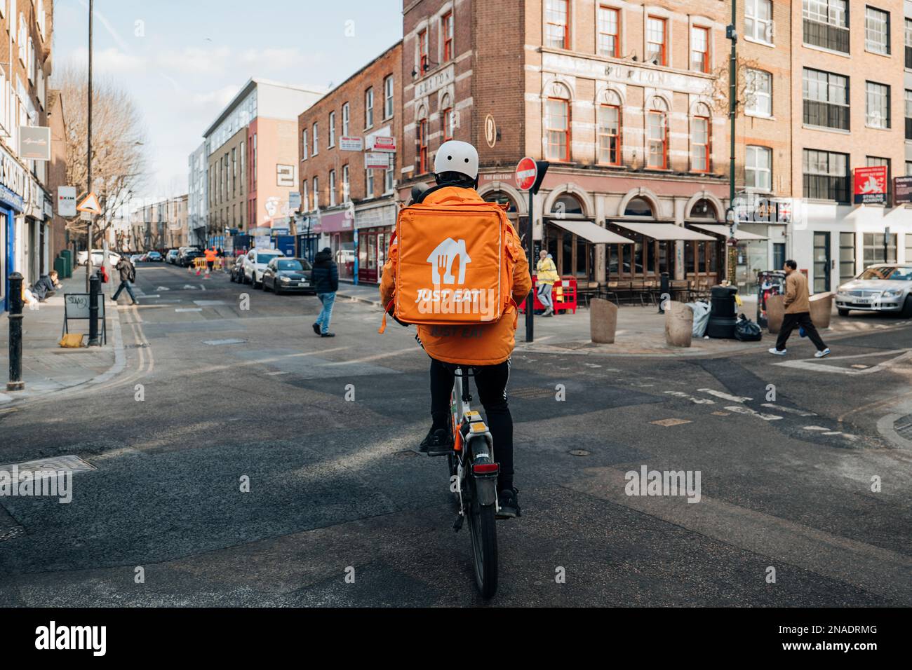 London, UK - February 09, 2023: Just Eat delivery driver on a street in ...