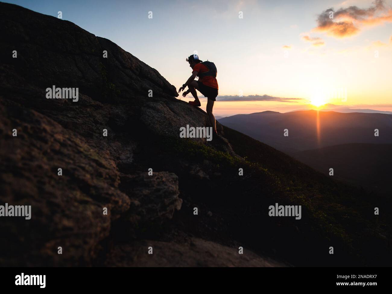 Man scrambling rocks hi-res stock photography and images - Alamy