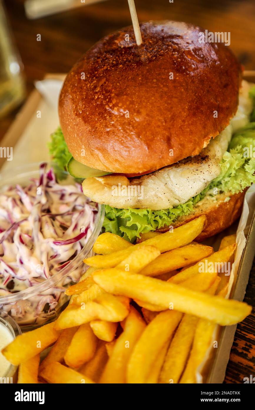 Fish burger on the beach Stock Photo - Alamy